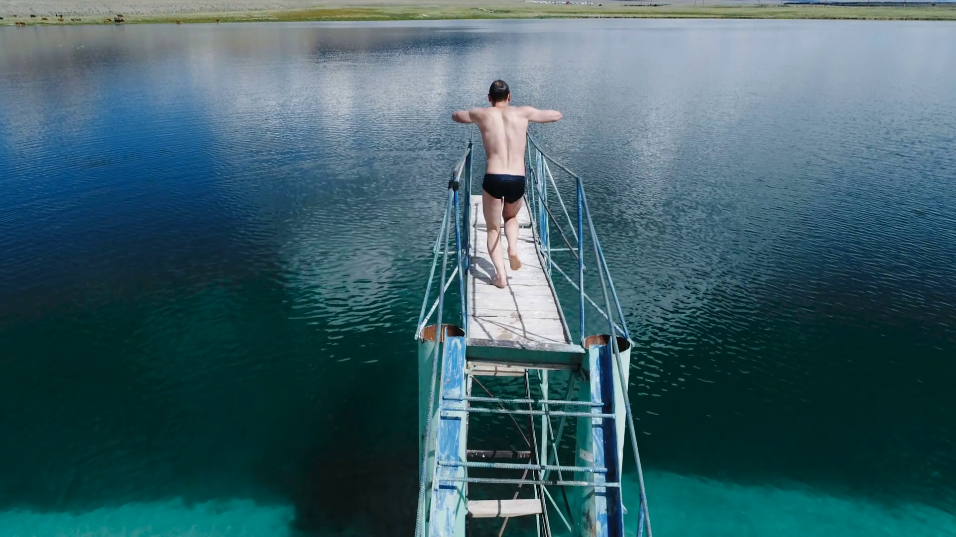 Man Jumping Off Cliff Into Ocean Summer Fun Stock Footage SBV-317231203 - Storyblocks