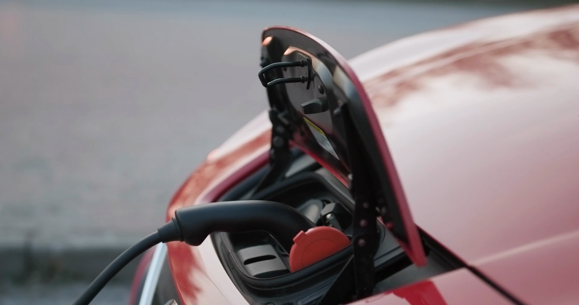 Electric car charger plugged in an electric vehicle. Stock Video ...