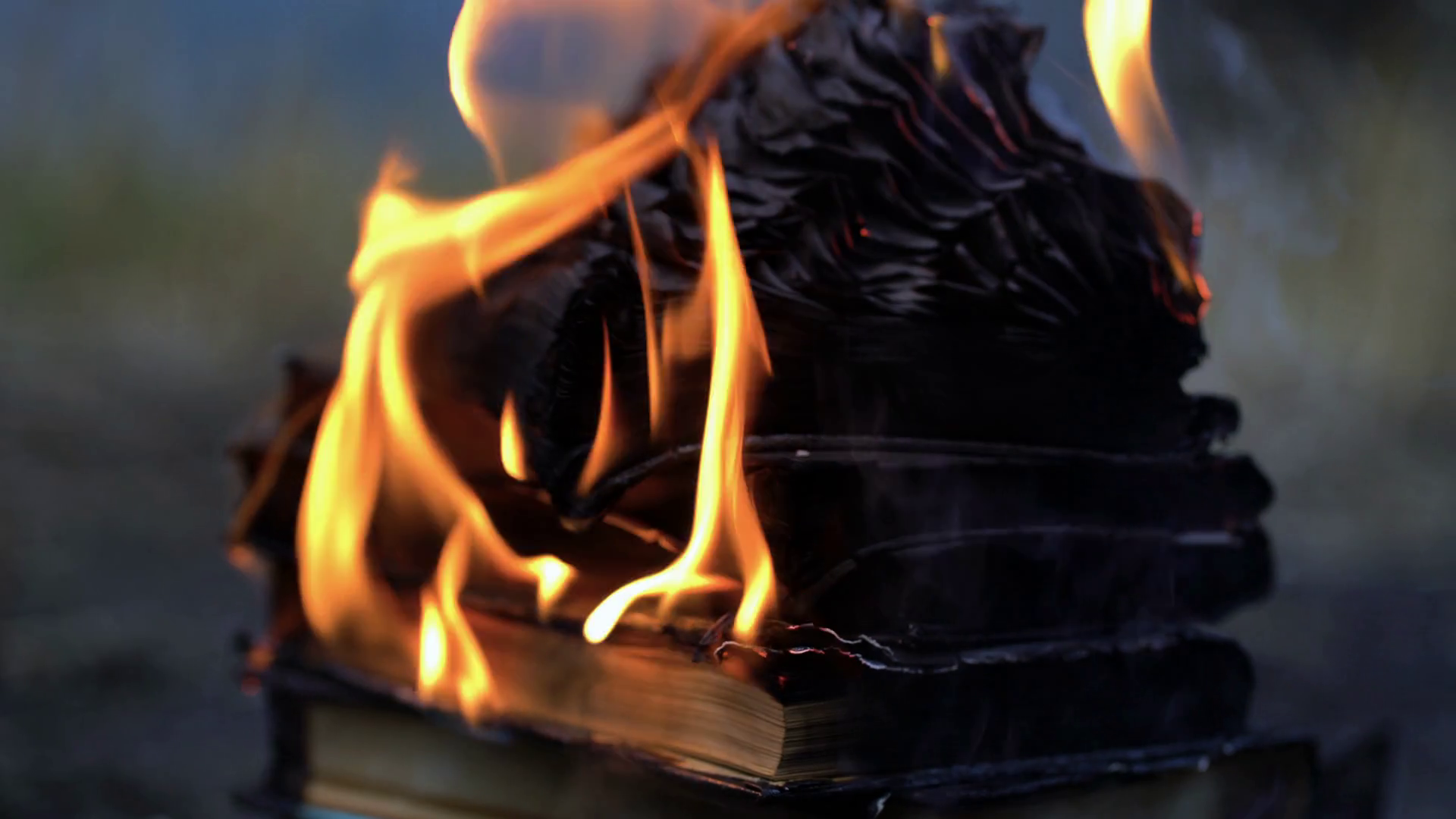 Bonfire of burning books. Flame smoke and ashes in place of burnt books ...
