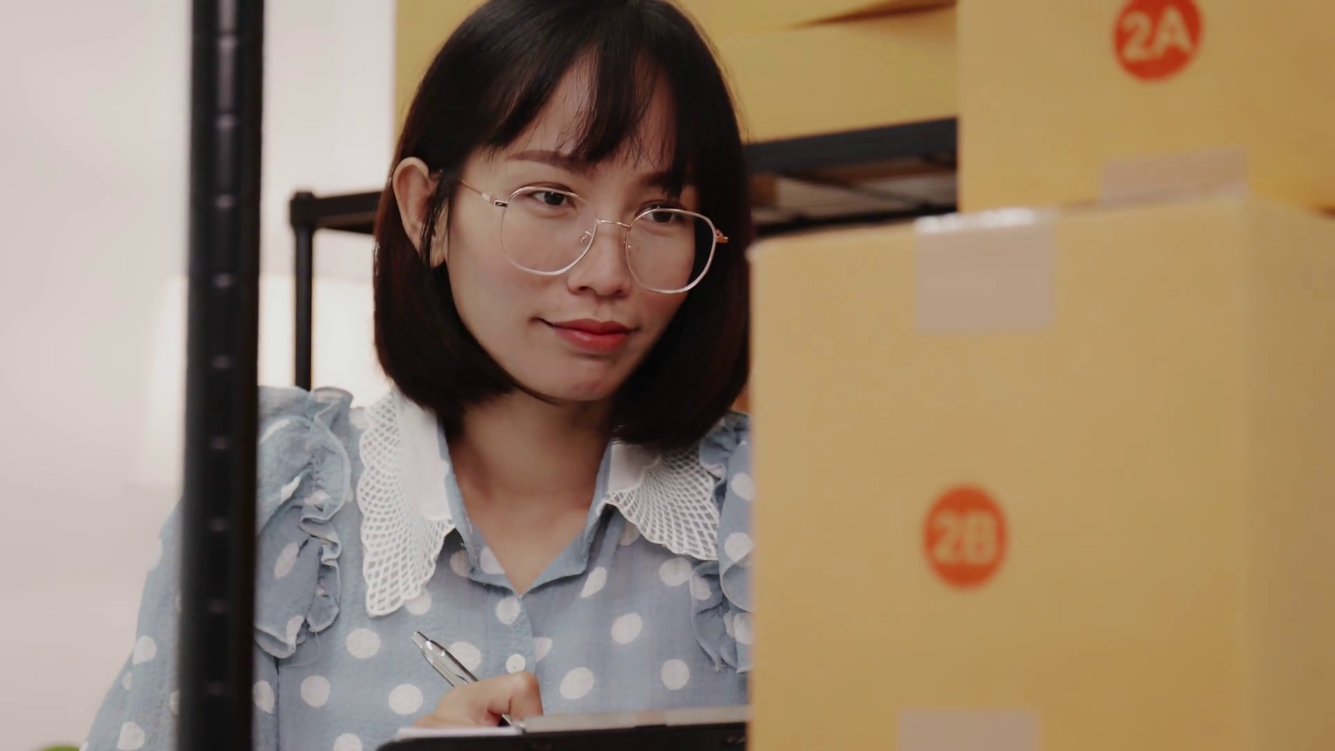 Young Asian Woman Checking List With Parcels Stock Footage SBV ...