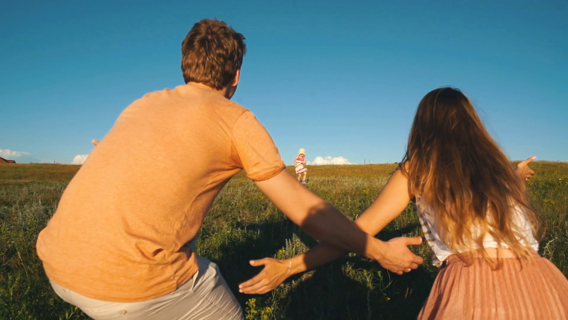 Cute Little Girl Runs Into Hands Of Parents Stock Footage SBV-315754104 ...