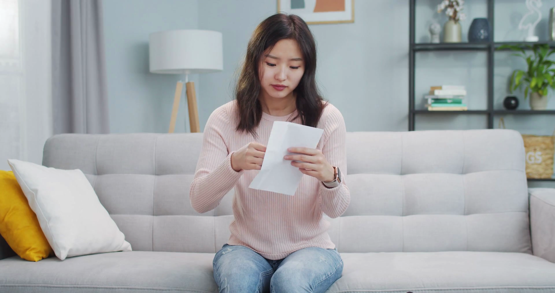 Girl Sitting On Sofa Opening Submission Stock Footage SBV-347266209 ...