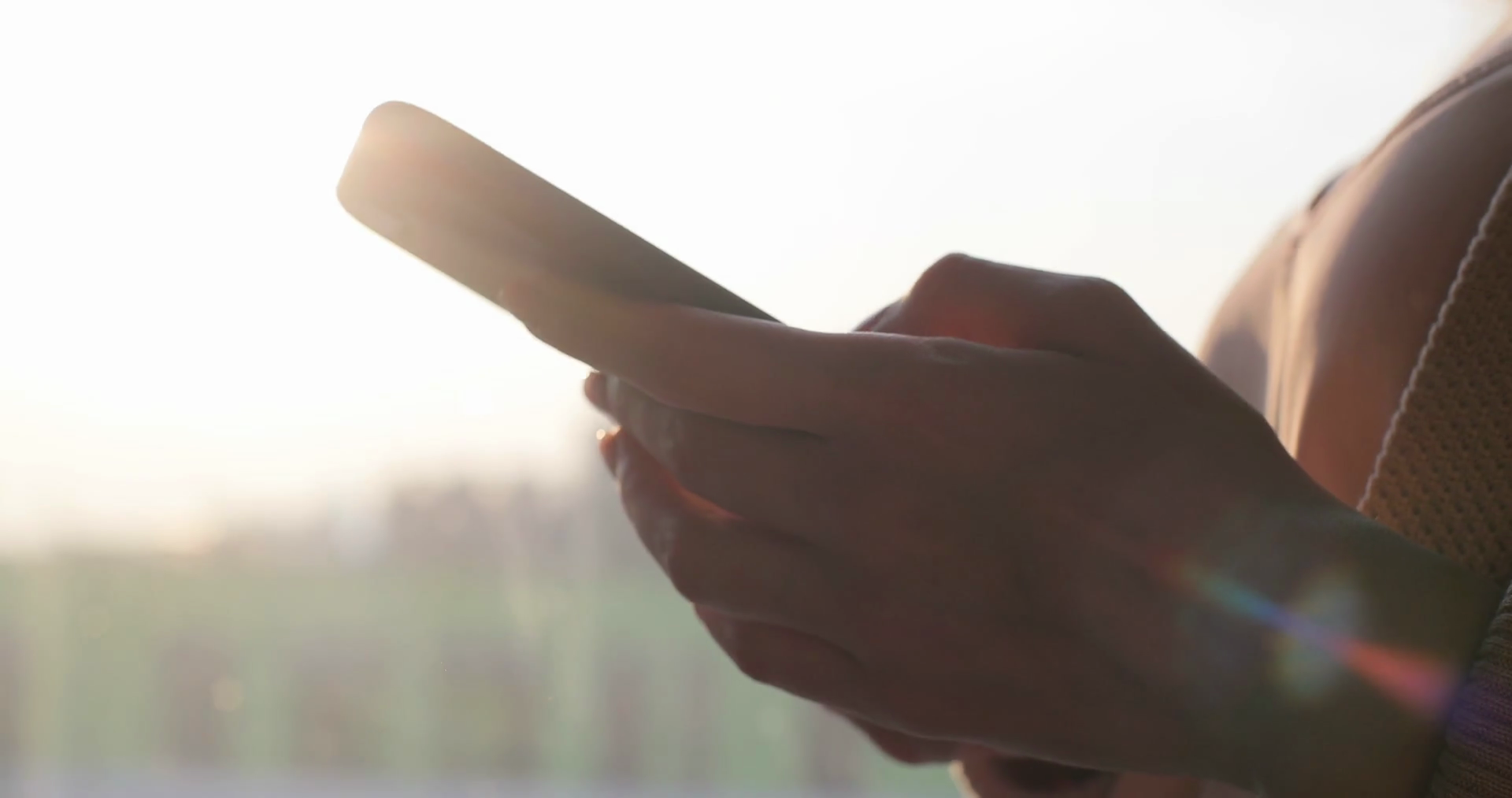 Female hand holding smart phone. Girl using mobile phone while standing ...