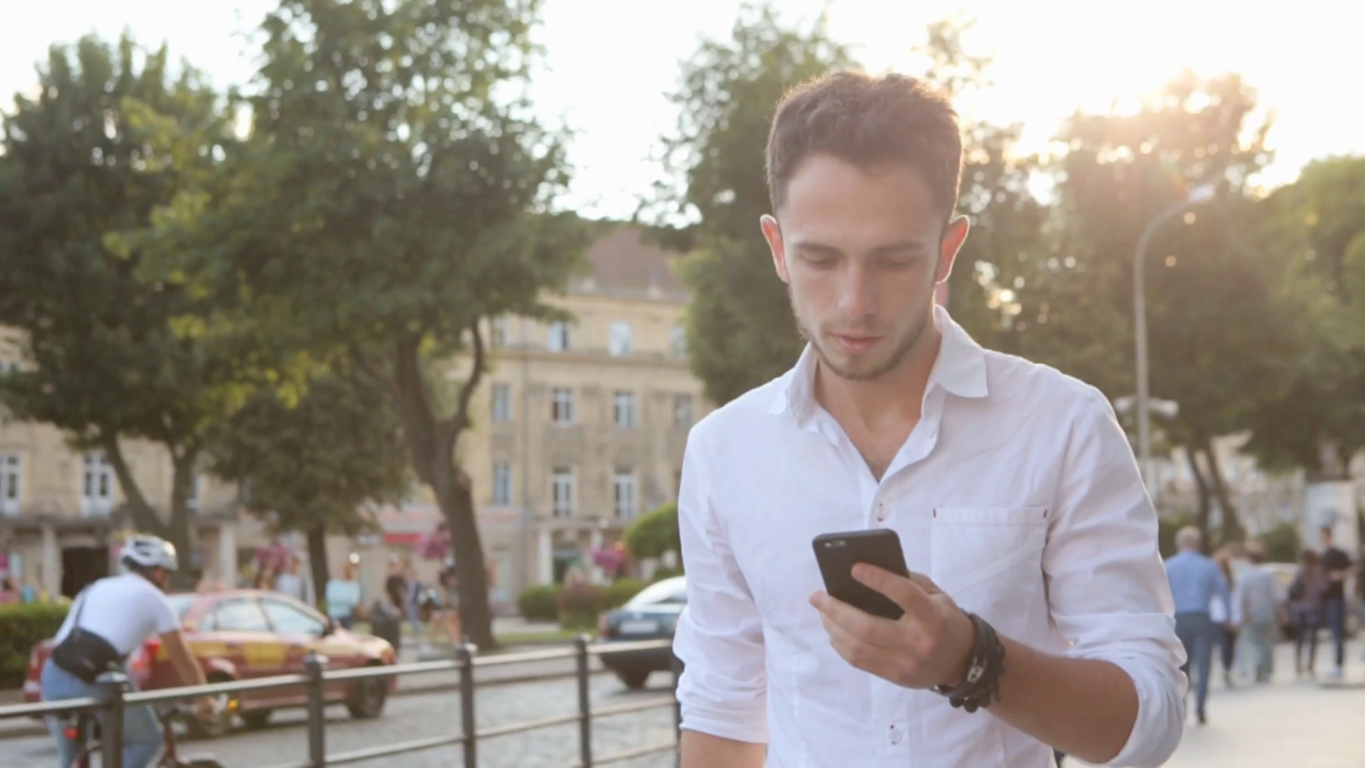 Handsome Guy Is Looking At Smartphone On Stock Footage SBV-305160325 ...