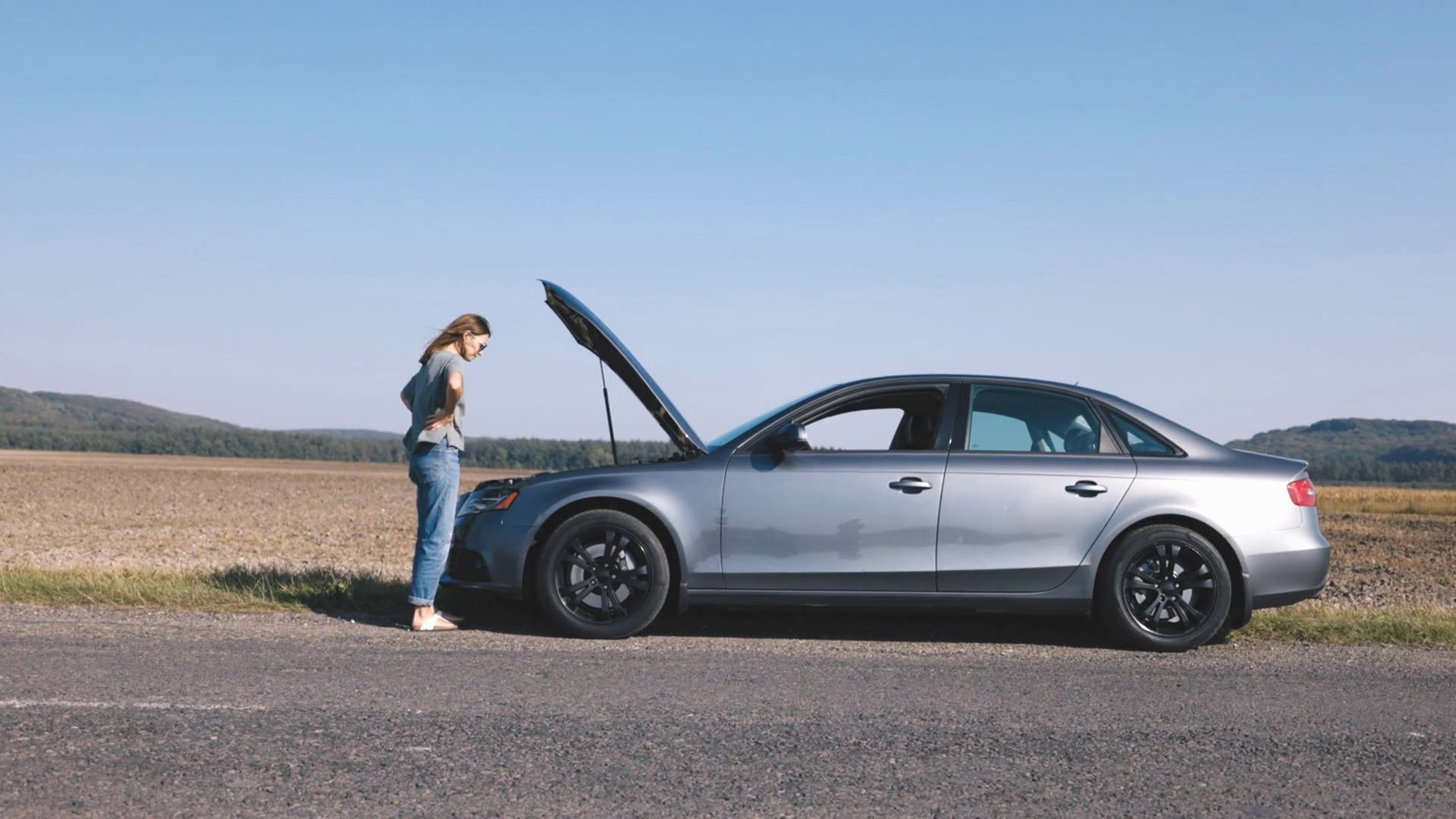 Young Woman Leaning Over Looking At Car Stock Footage SBV-348553825 ...