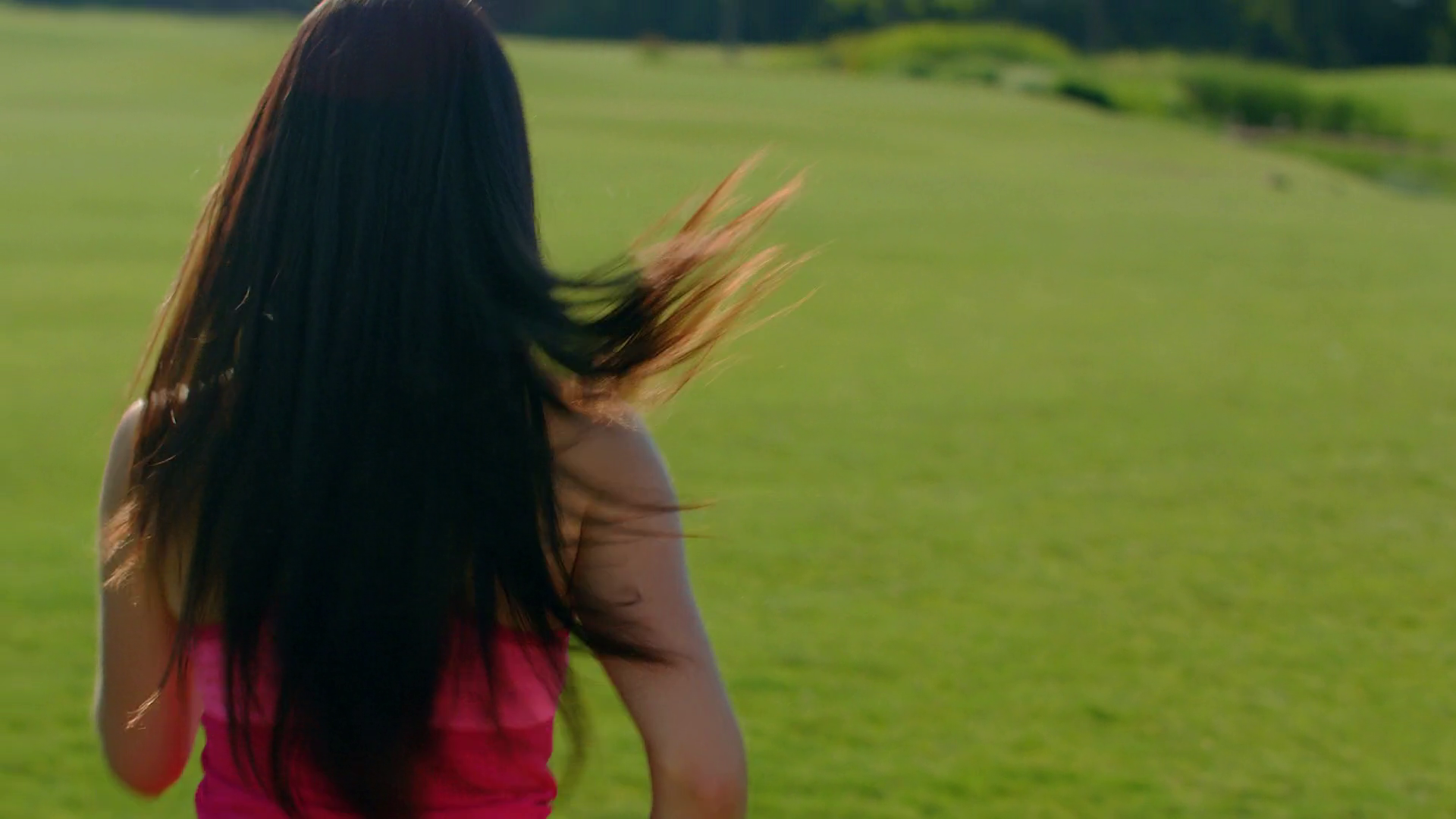 Long hair woman running in park. Back of running woman in slow motion ...