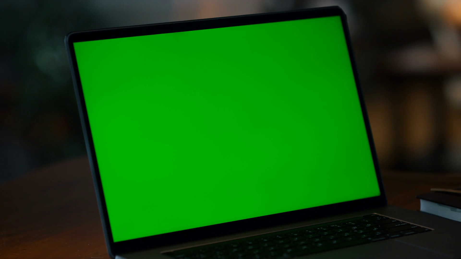 Closeup green screen computer on wooden table indoors. Laptop computer ...