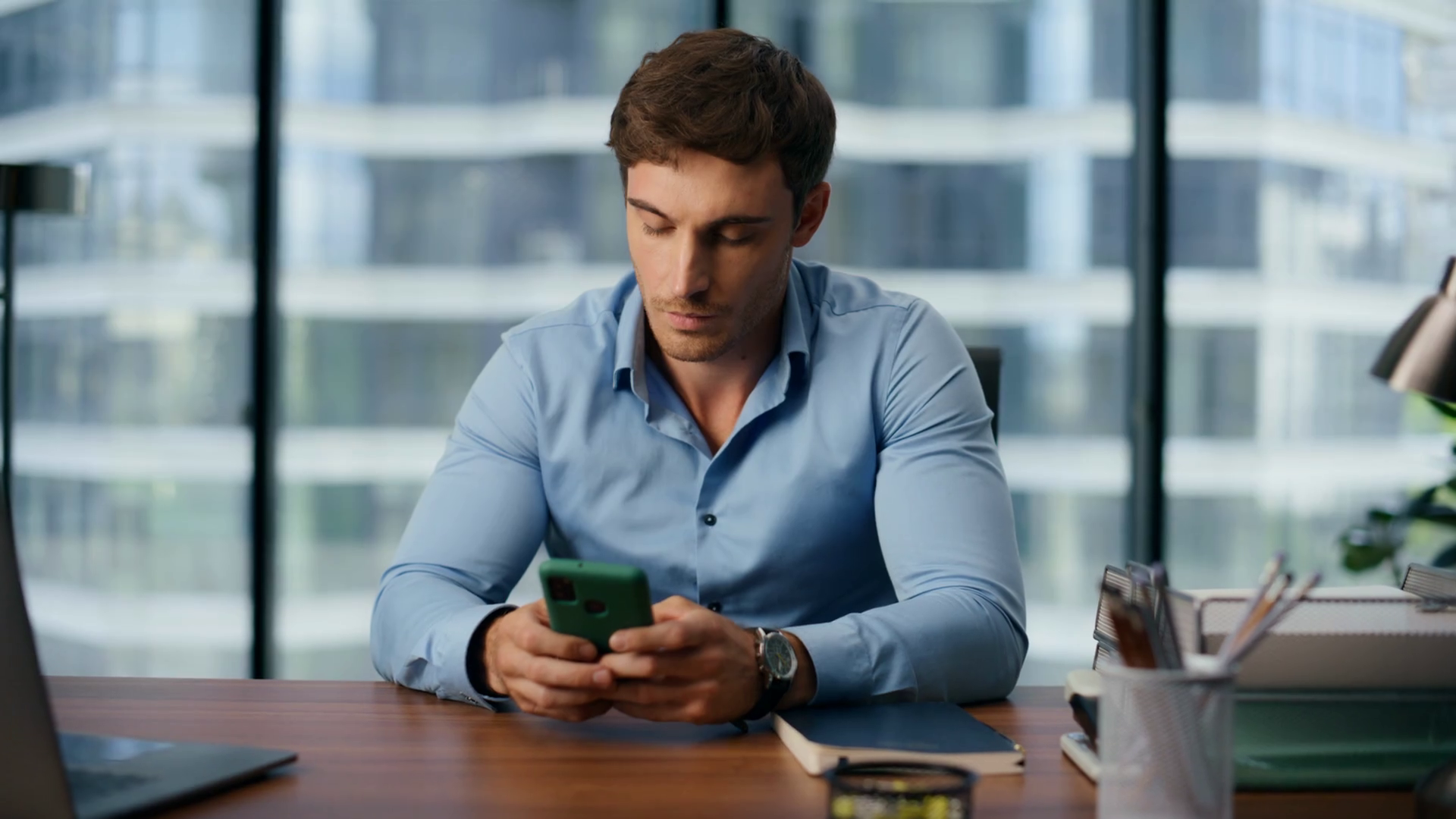 Closeup frustrated director searching decision with smartphone. Sad ...