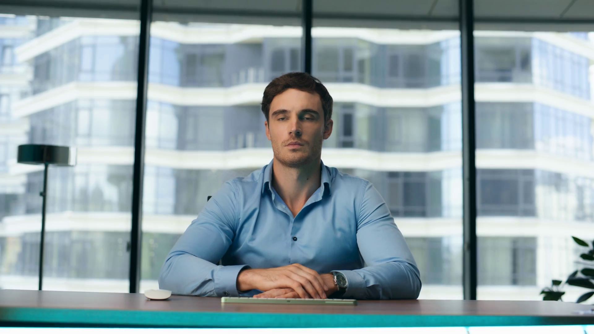 Serious man analyst using invisible screen working modern futuristic ...