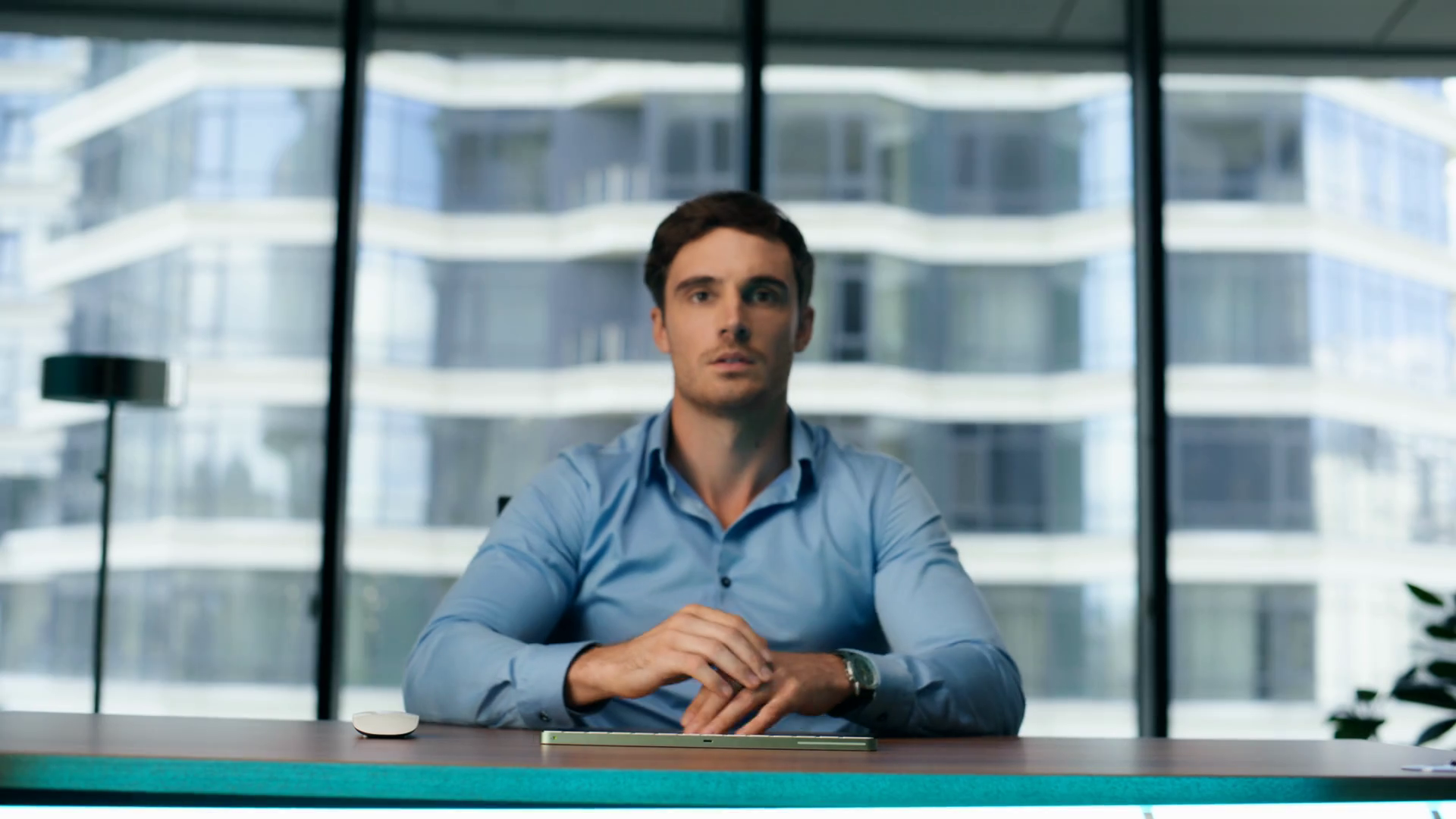 Young manager using futuristic augmented reality software interface for ...