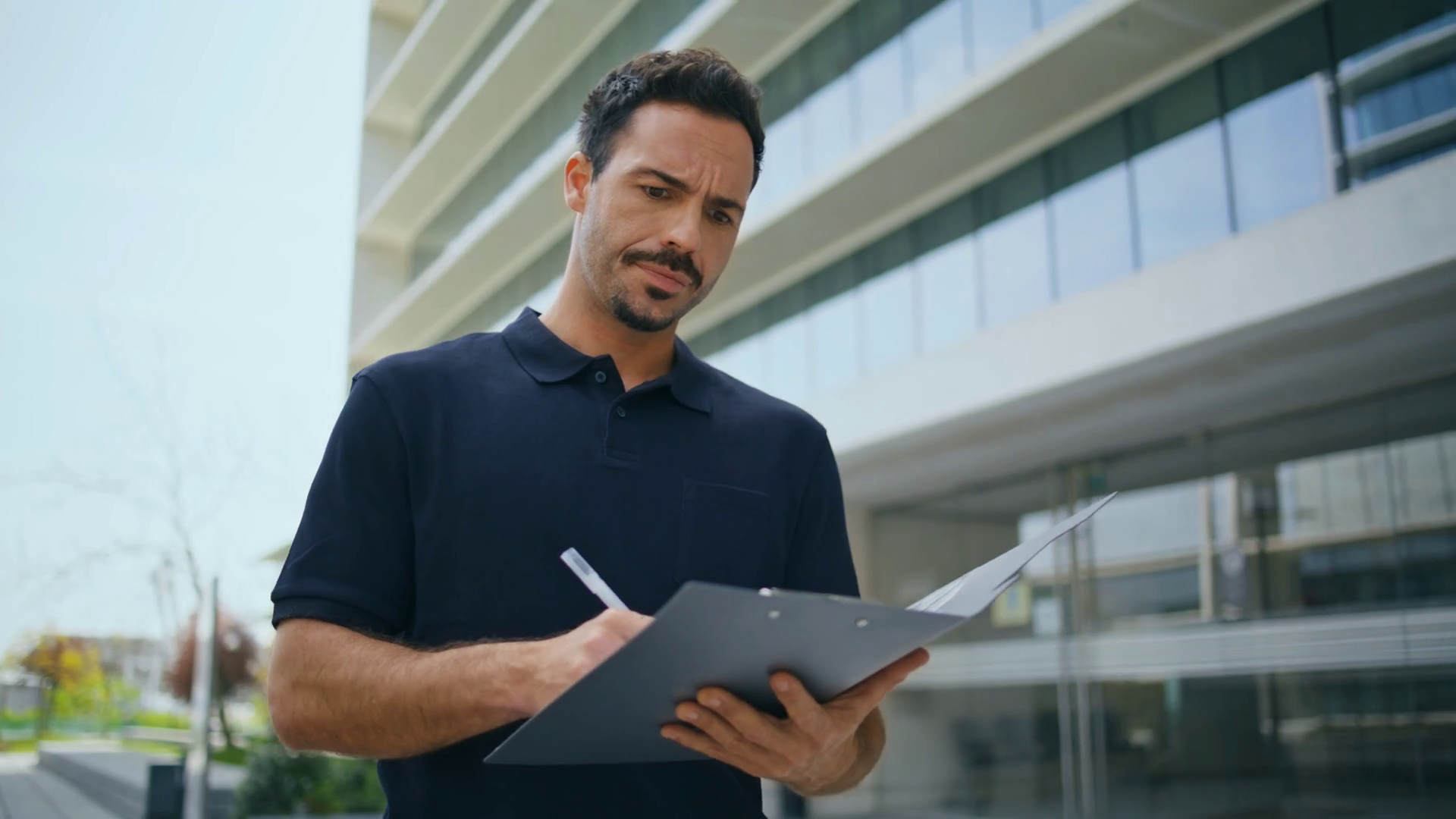 Focused Man Signing Report On Street In Stock Footage SBV-348725811 ...