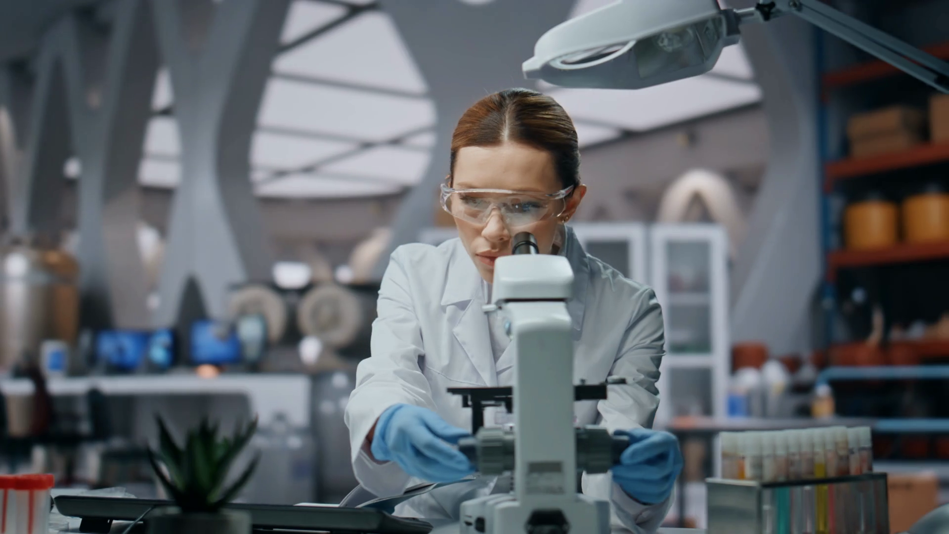 Female Scientist Using Microscope Conducting Stock Footage SBV ...
