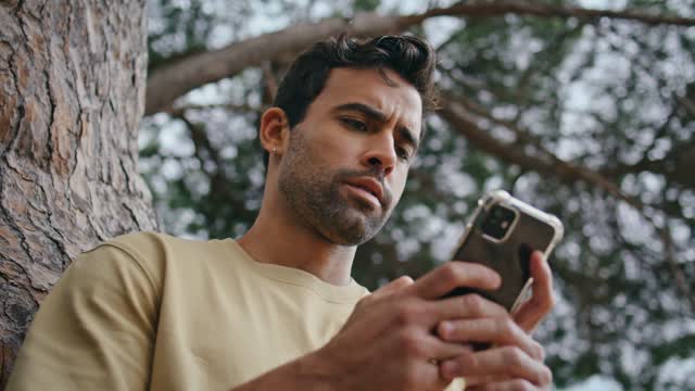 Man Watching Mobile Stock Footage: Royalty-Free Video Clips - Storyblocks