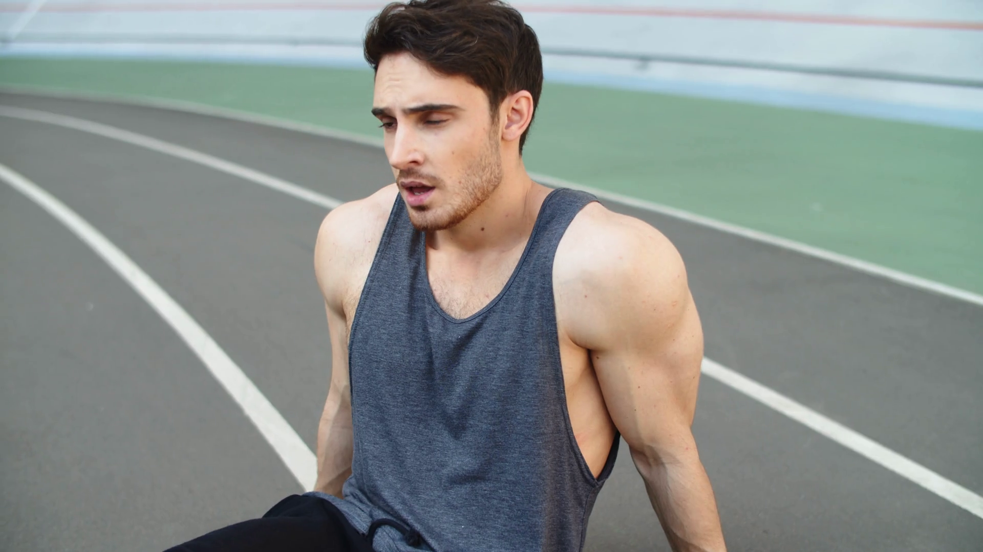 Close Up Of Tired Runner Sitting On Track Stock Footage SBV-337954914 ...