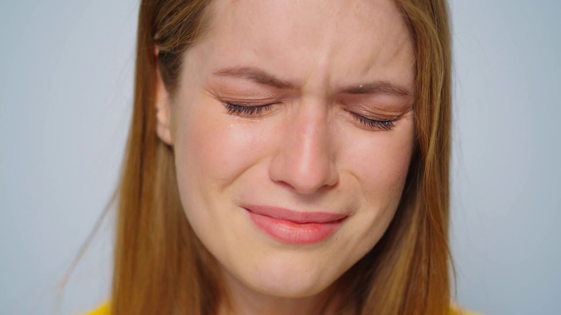 Closeup crying woman posing in studio. Portrait of unhappy woman crying ...