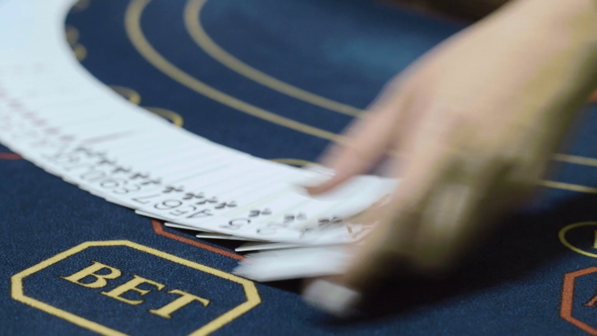 Dealer working on poker table. Close up of hands of dealer with playing ...