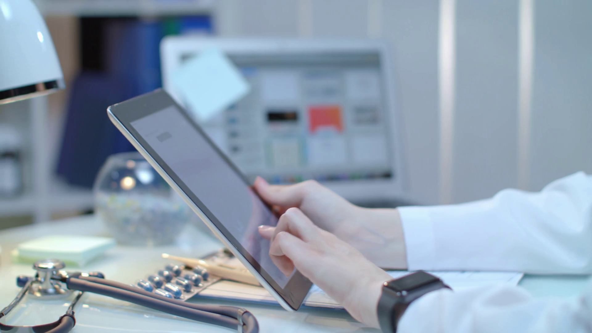 Female doctor using tablet at medical workplace. Nurse using tablet pc ...