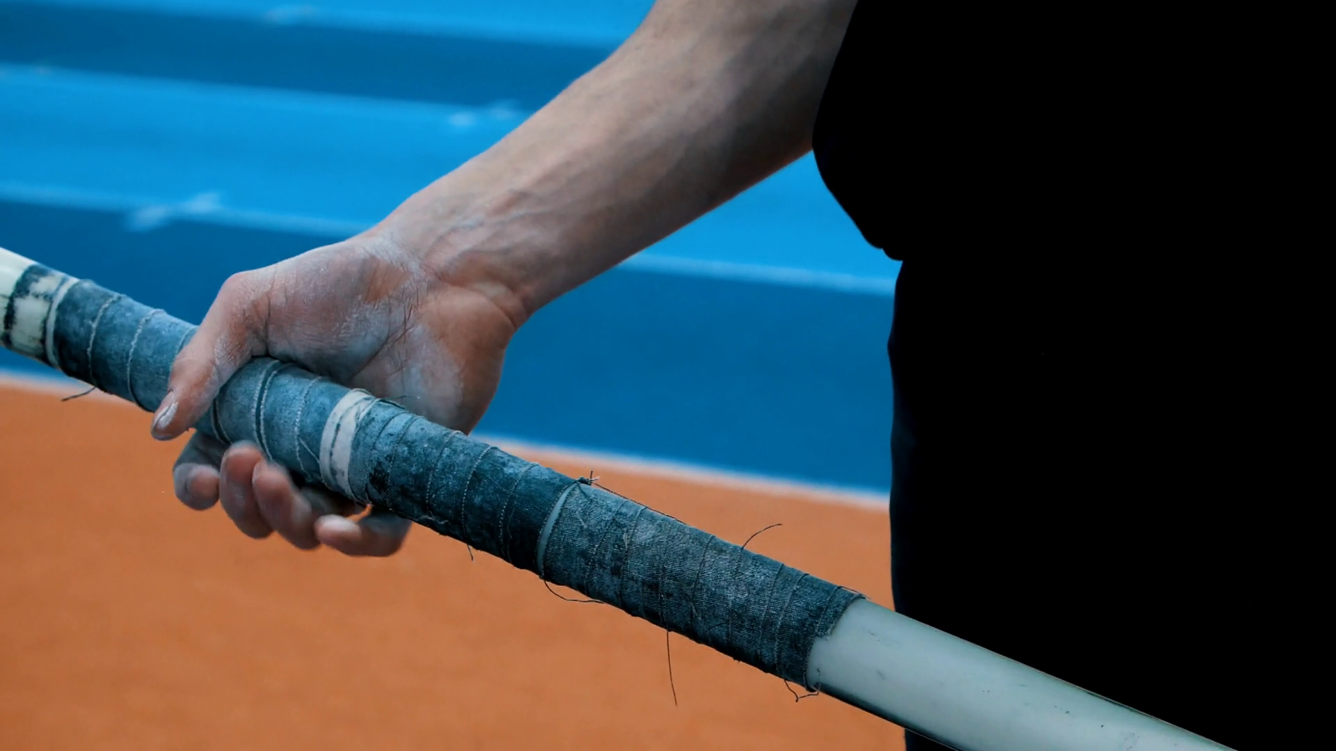 Hands athlete holding sports equipment. Athlete preparing to jump in ...