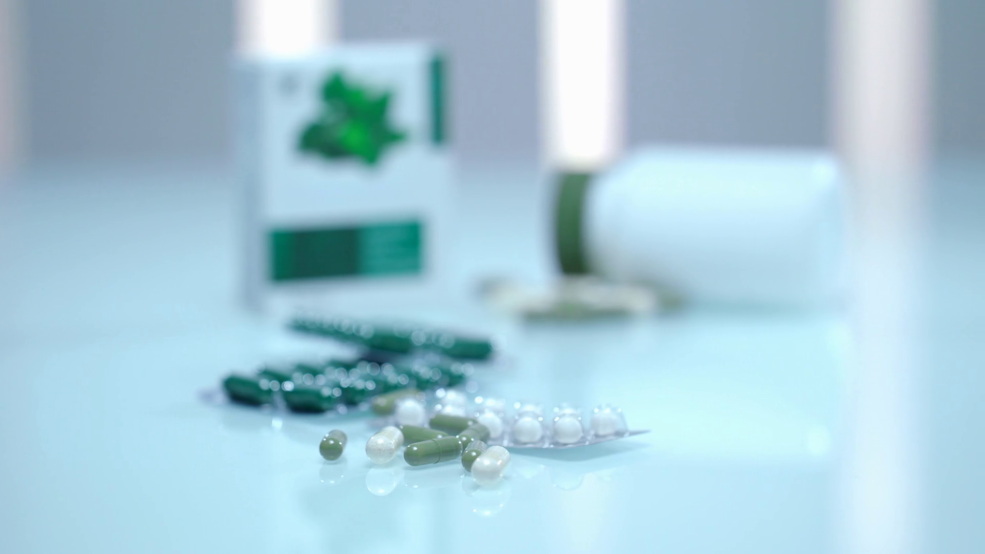 Homeopathic medicine pills and capsules on white background ...