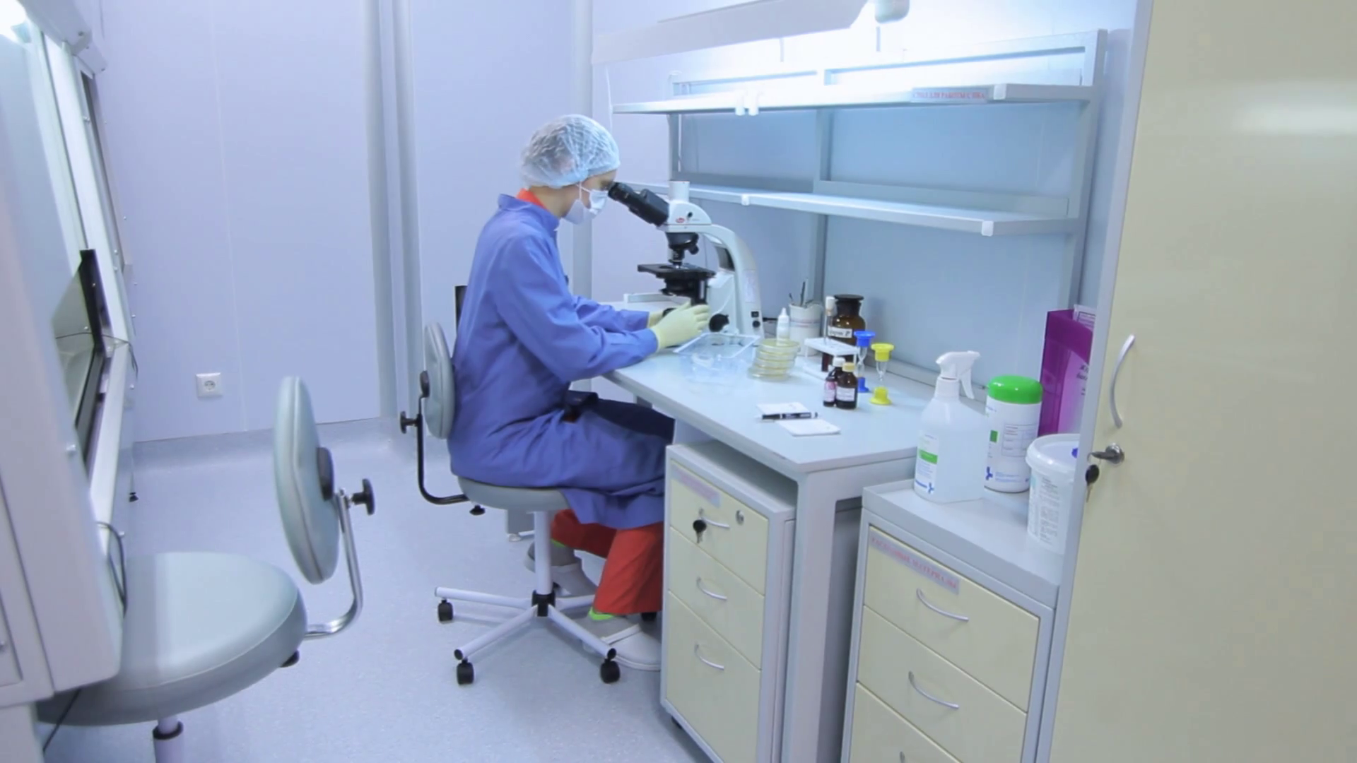 Lab Scientist Looking Through Microscope In Stock Footage SBV-322806993 ...