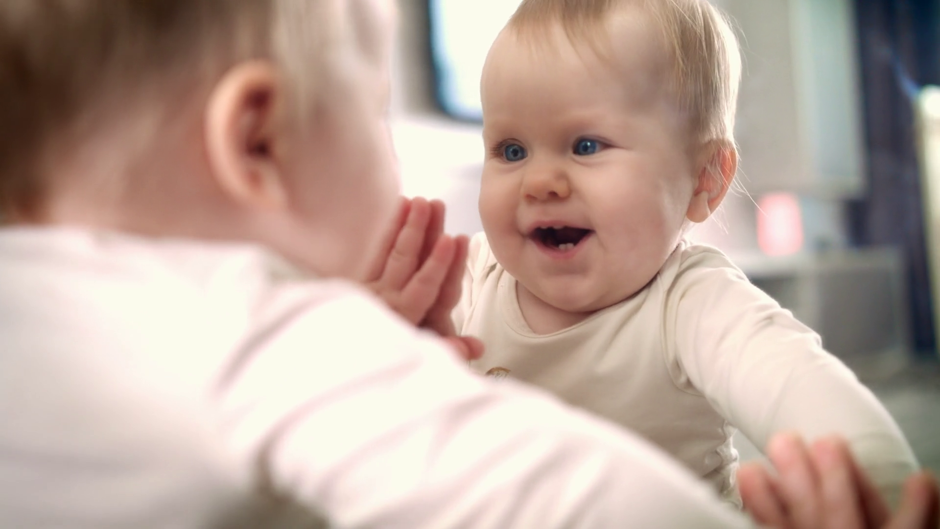 Little baby looking in mirror. New born baby smile. Little kid play ...