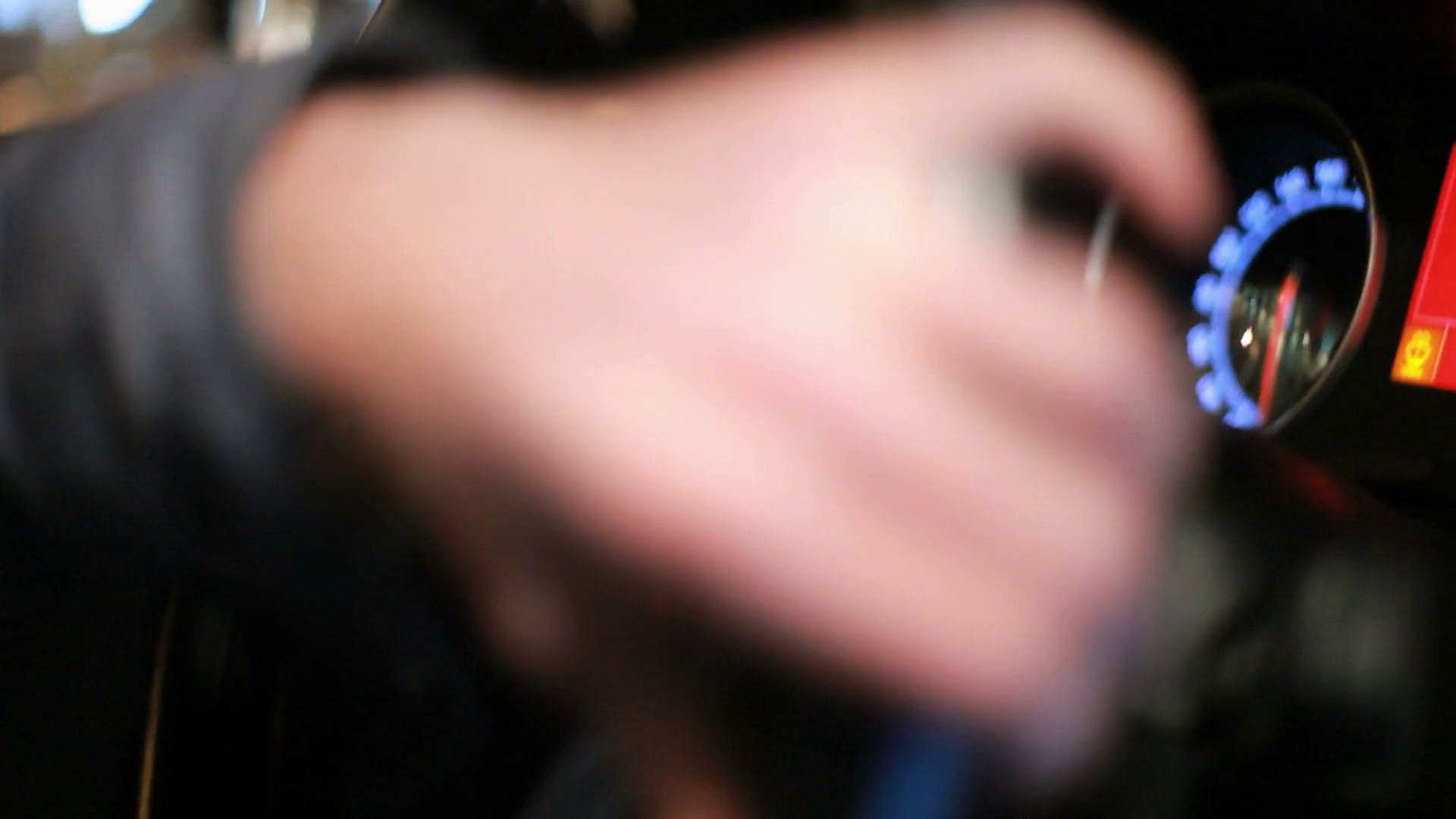 Male hands rotating car steering wheel. Close up of man driving car in ...