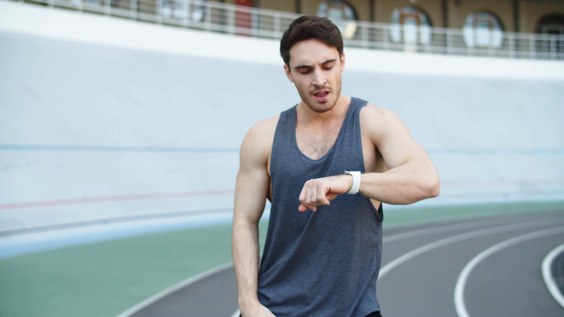 Male runner running at modern track. Sport man running on racetrack at ...