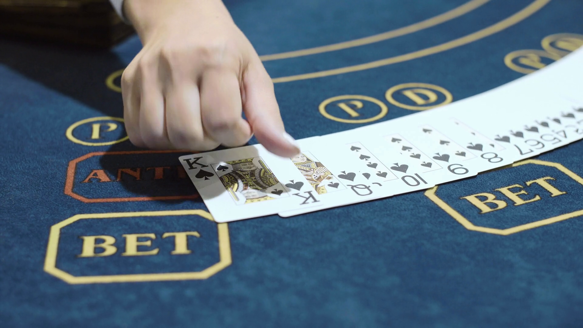 Professional female croupier working during cards shuffle in casino ...