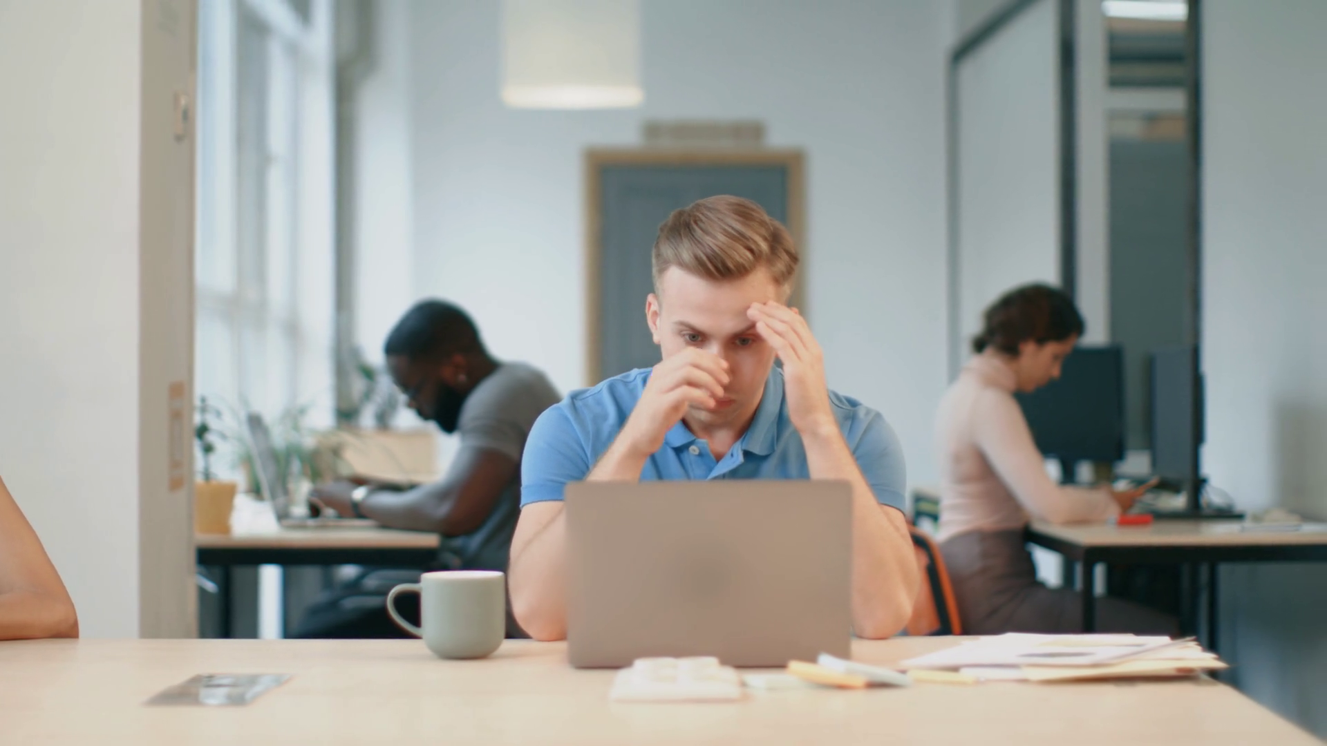 Serious man watching computer at workplace. Male person reading shocked ...