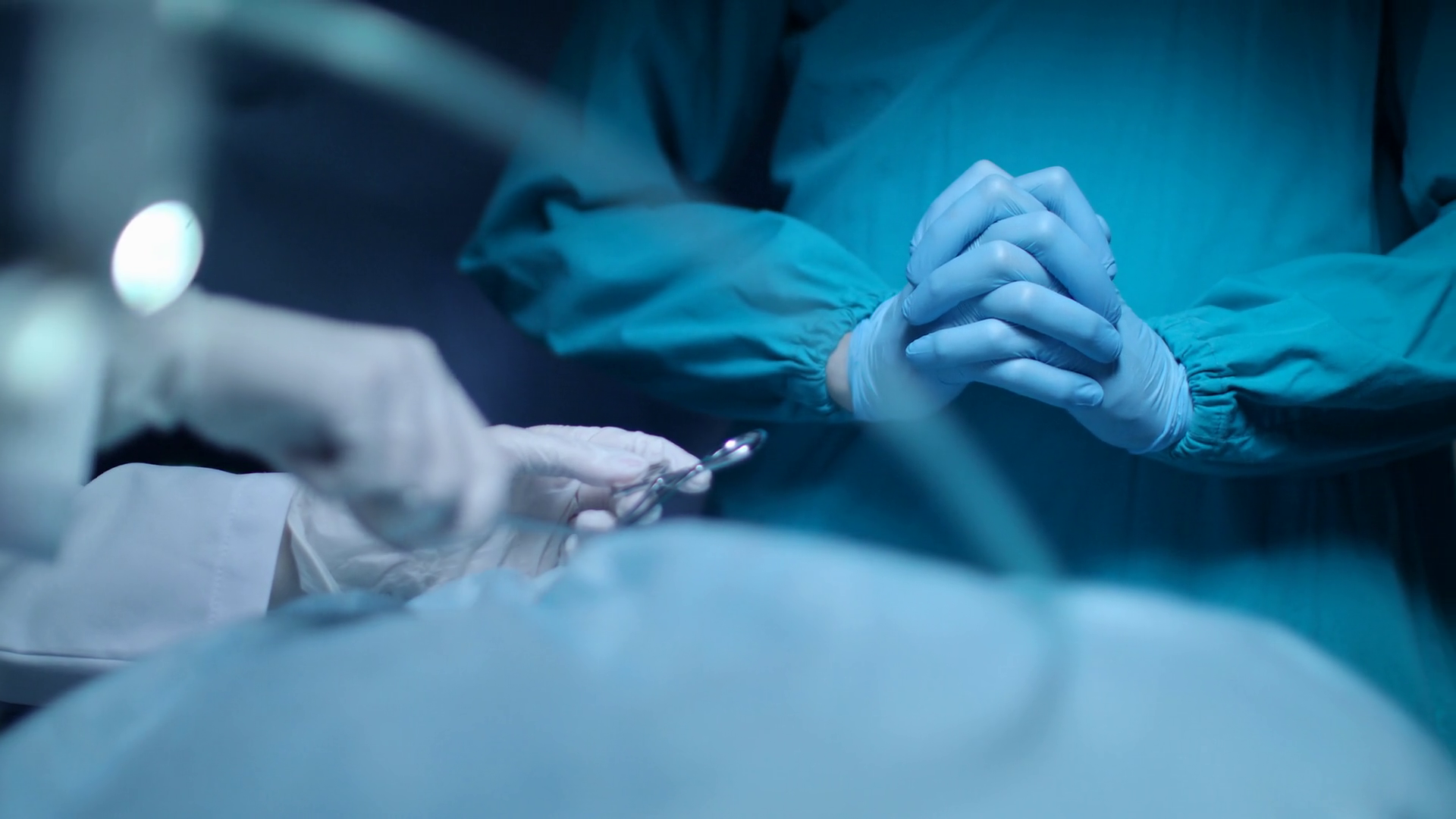 Surgeon hand working with surgeon tools. Medical hand praying at ...