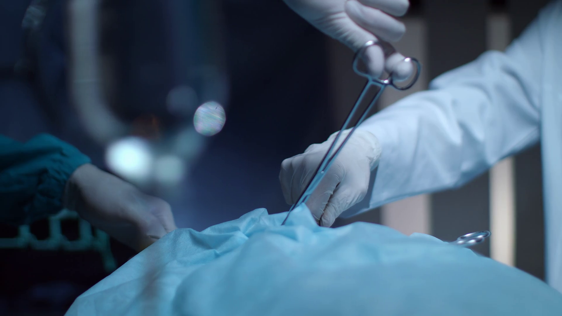 Surgery operation hands in operating room. Close up of medical team ...