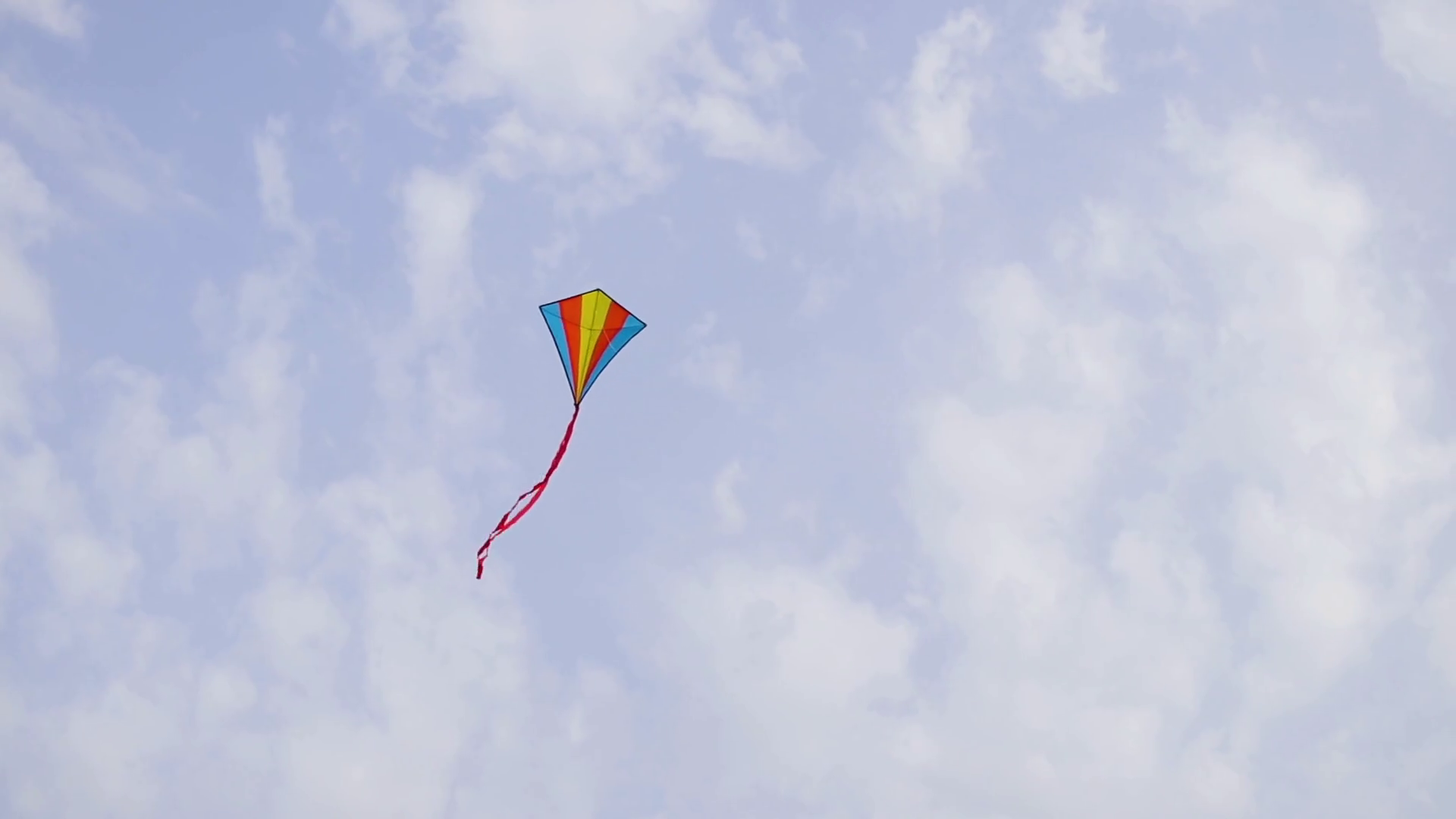 A Multi-colored Kite Flying High In Sky Stock Footage SBV-347730585 ...
