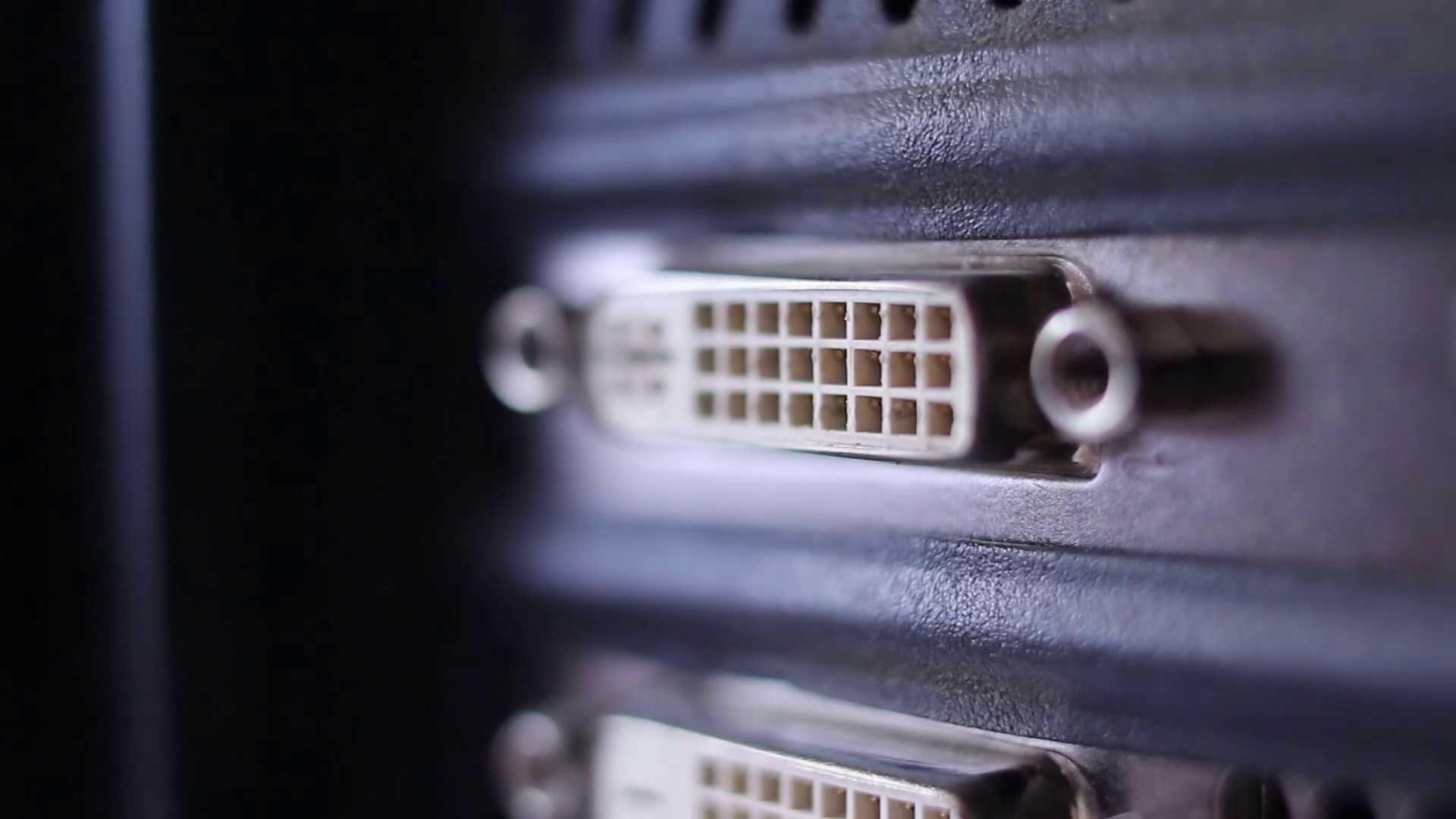 DVI connector on graphics card, Hand connects plugs in a DVI Stock ...