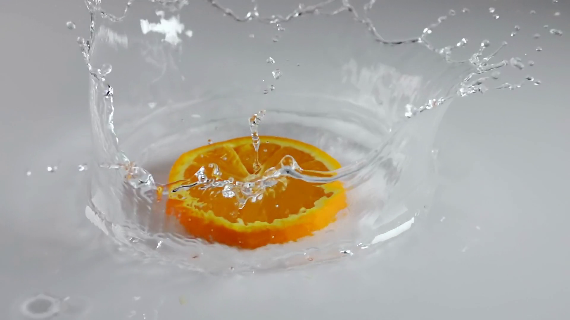 Piece Of Orange Falls Into Water Slow Motion Stock Footage SBV ...