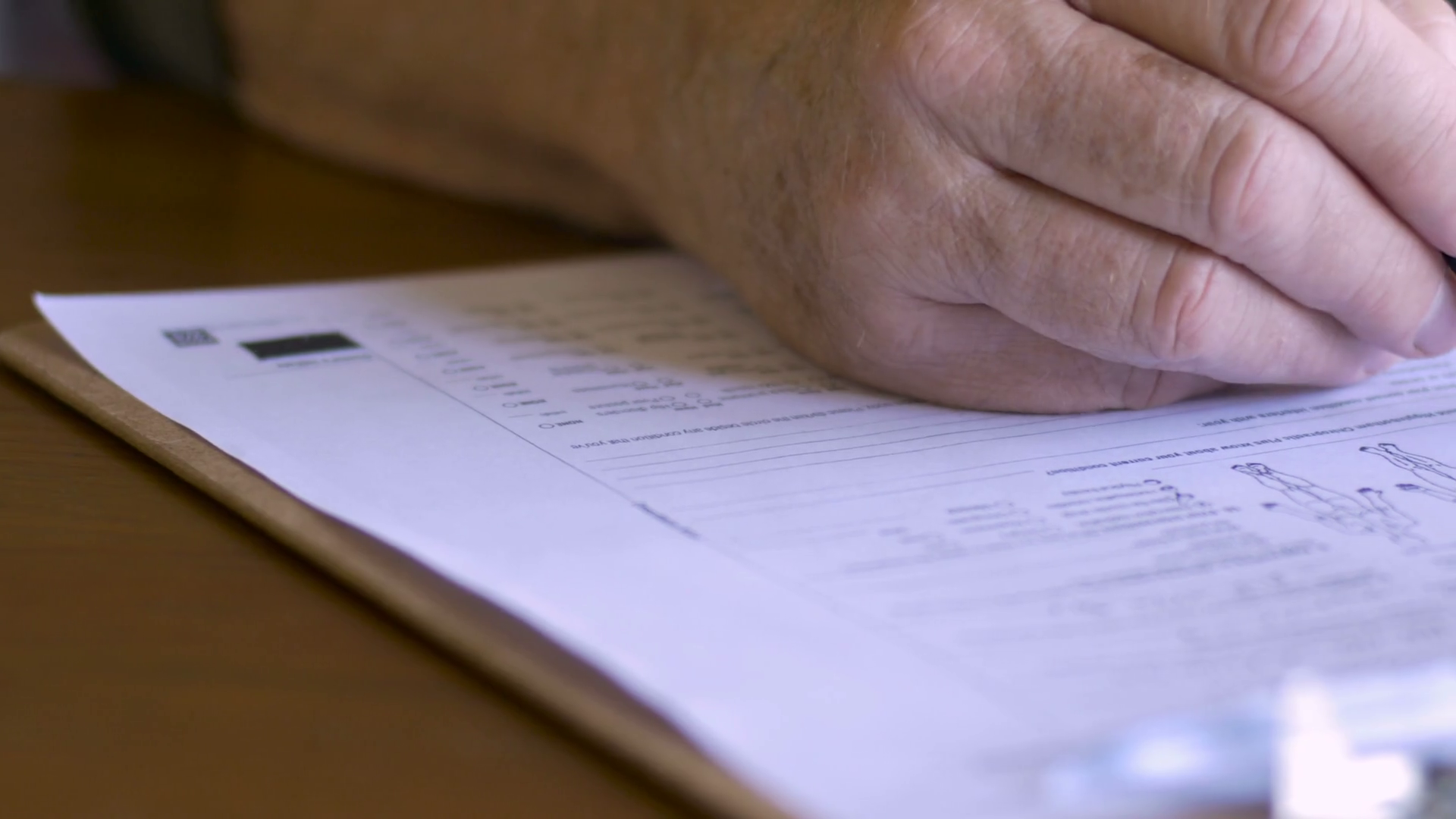 An Elderly Man Fills Out Medical Form On Stock Footage SBV-306243996 ...