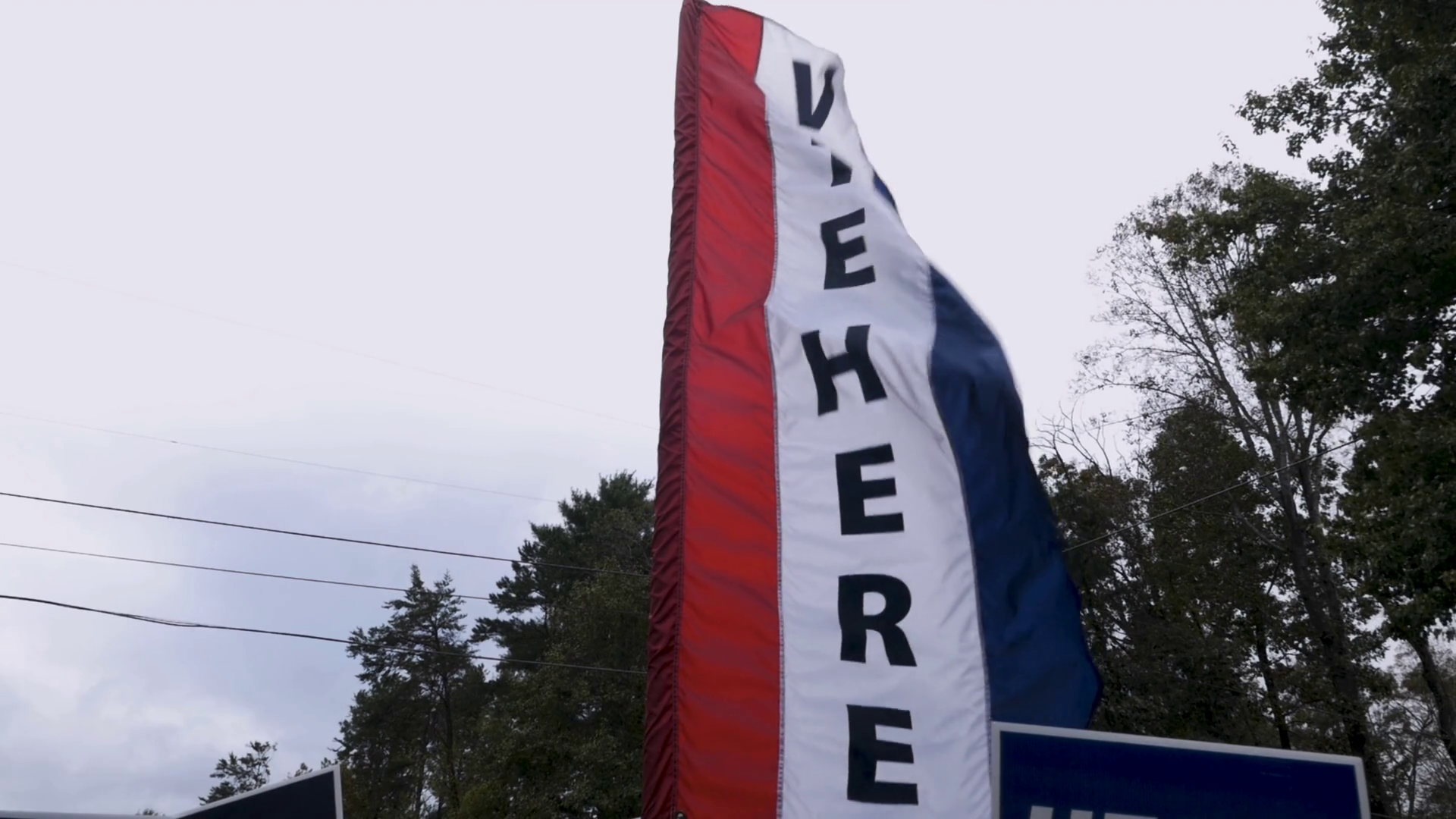 Slow Motion Of Red White Blue Vote Here Sign Stock Footage SBV ...