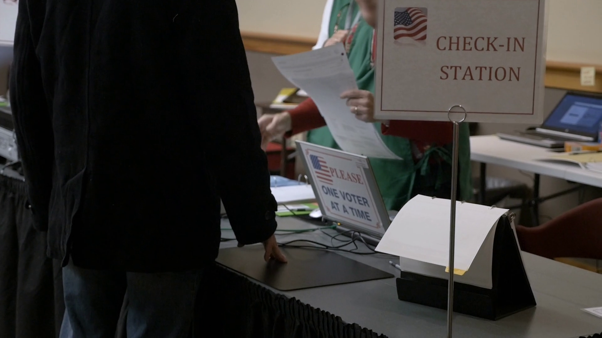 Voter Receiving Ballot From Poll Worker In Stock Footage SBV-328524789 ...