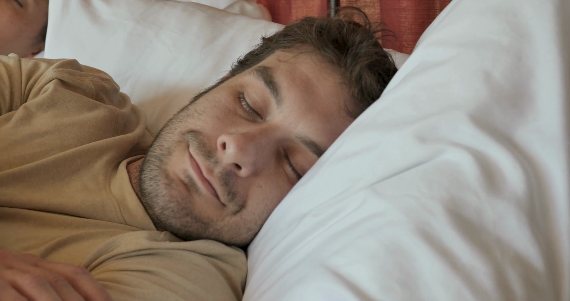 Young attractive couple in love wake up happy and smiling after a good ...