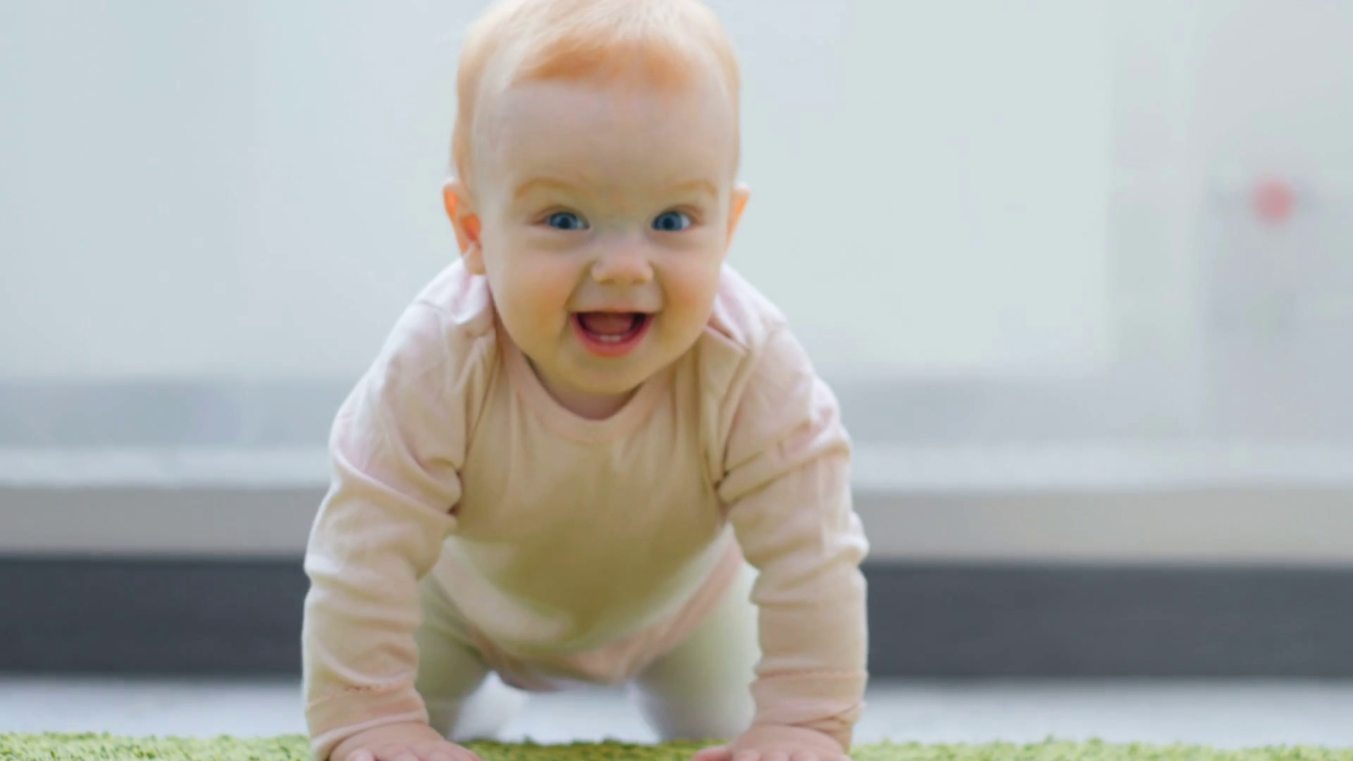 Child Learns To Crawl On Floor In Childrens Stock Footage SBV-332257021 ...
