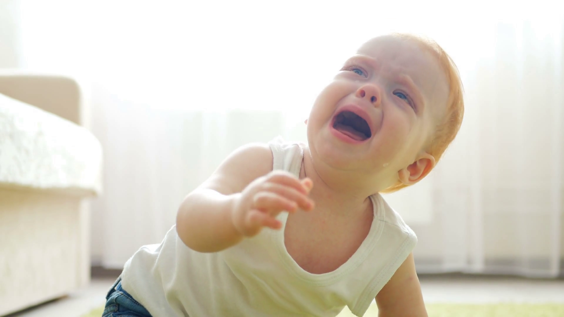 Crying redhead baby girl sitting on the floor Stock Video Footage ...