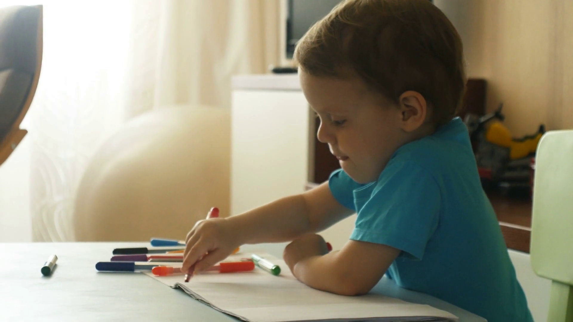 Preschool boy focused on drawing by felt-tip pen Stock Video Footage 00 ...