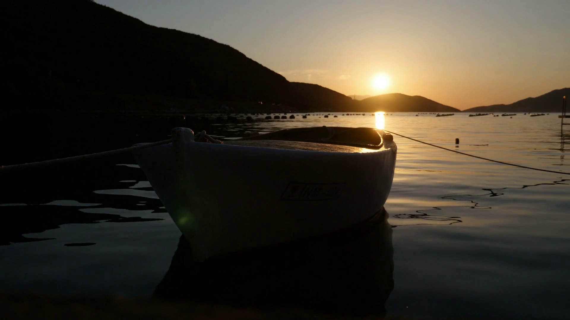 Serene Sunset: Capturing Small Wooden Boat Stock Footage SBV-311604385 ...