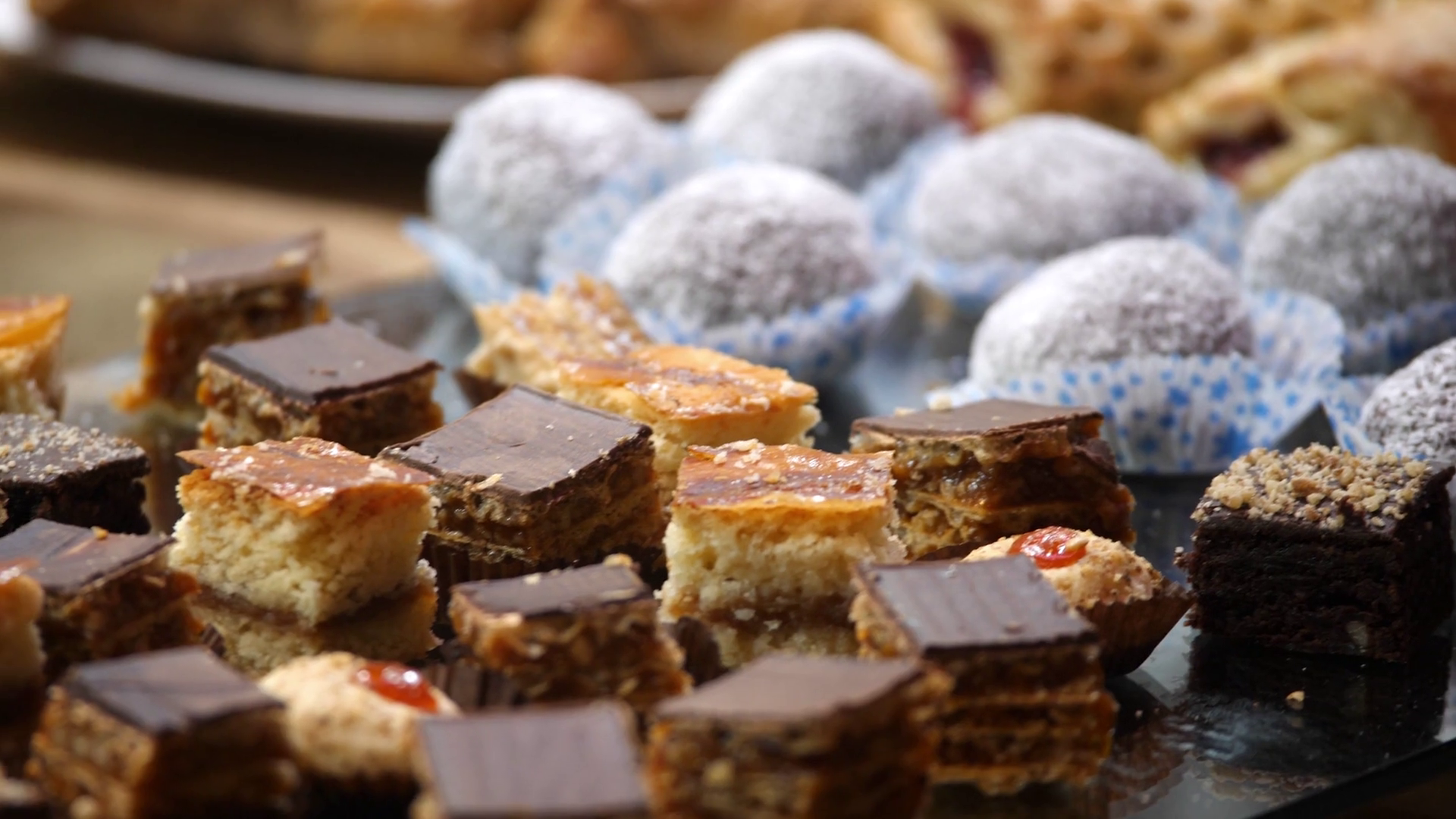 A Variety Of Delicious Small Cakes On Display Stock Footage SBV ...
