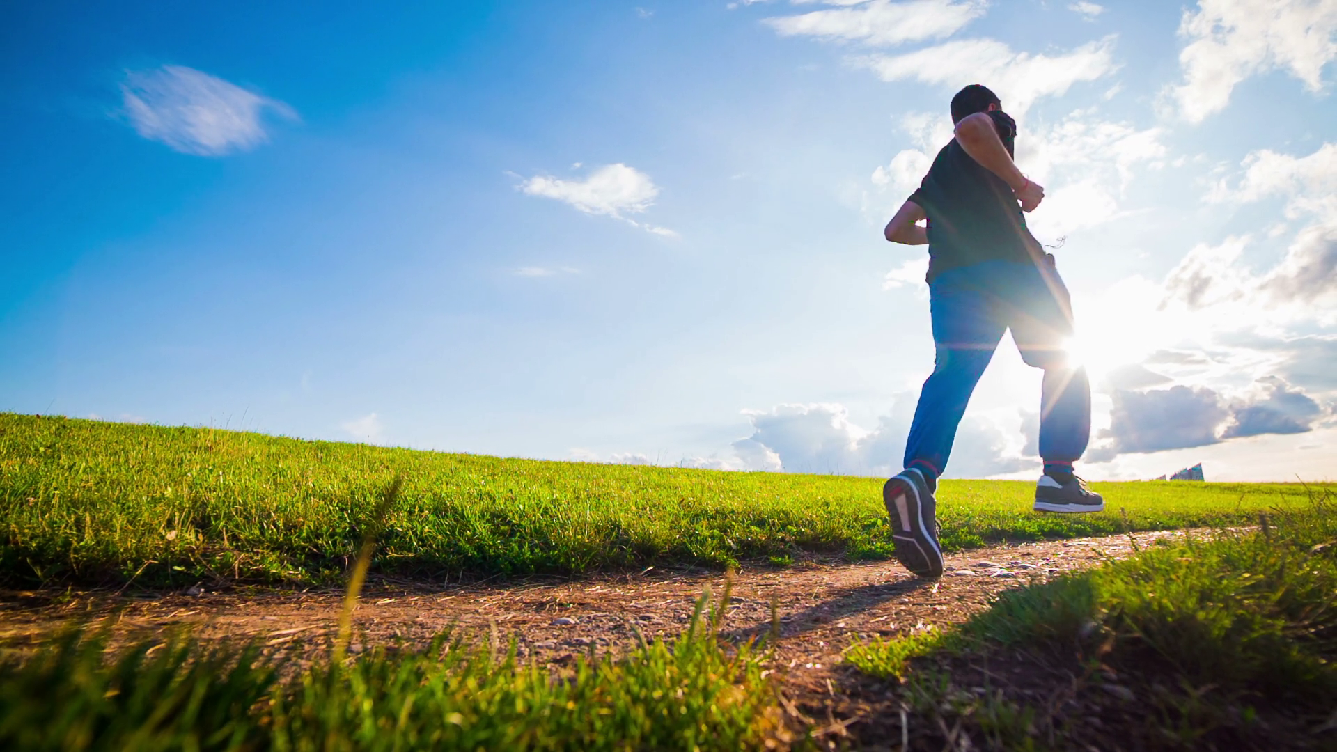Exercise Running At Sunset Slow Motion. Low angle shot of jogger ...