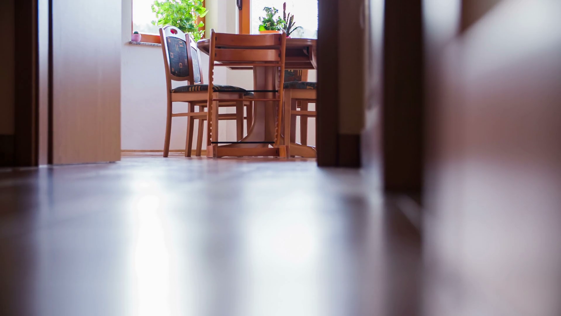 Kid legs running to another room close up. Low angle slow motion of ...