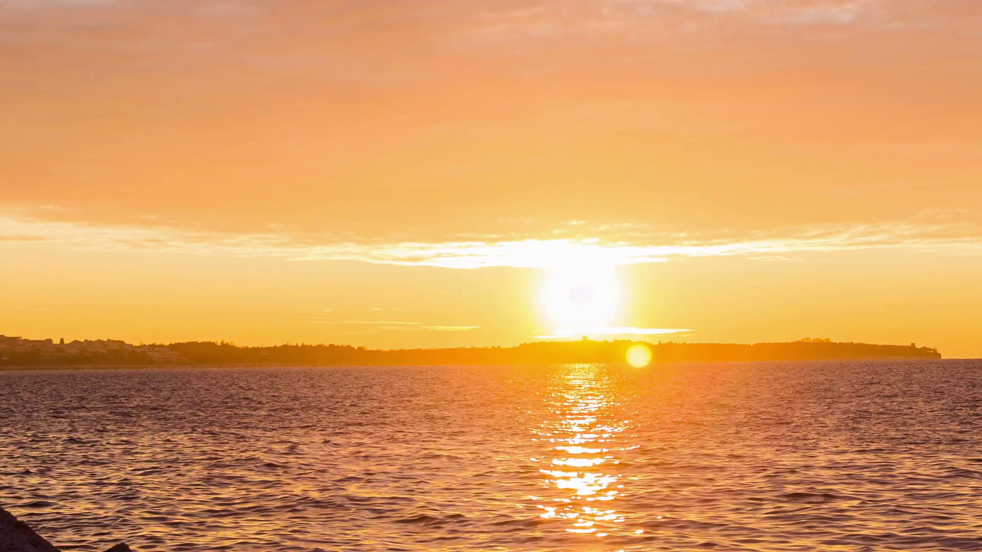 Sunset with wavy sea.Wide shot of beautiful sunset with defused ...