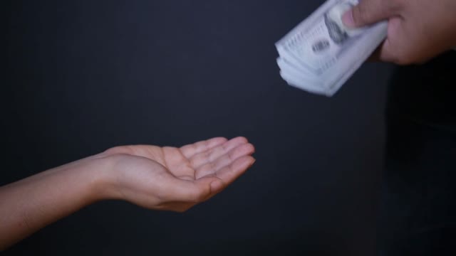 Man Giving Money Stock Footage: Royalty-Free Video Clips - Storyblocks