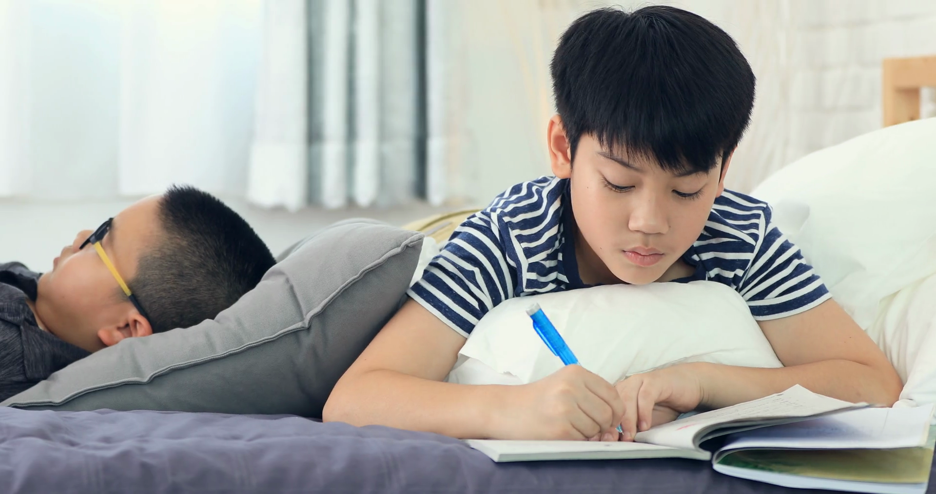 Asian Boy Doing Homework At Home With Friend Stock Footage SBV ...