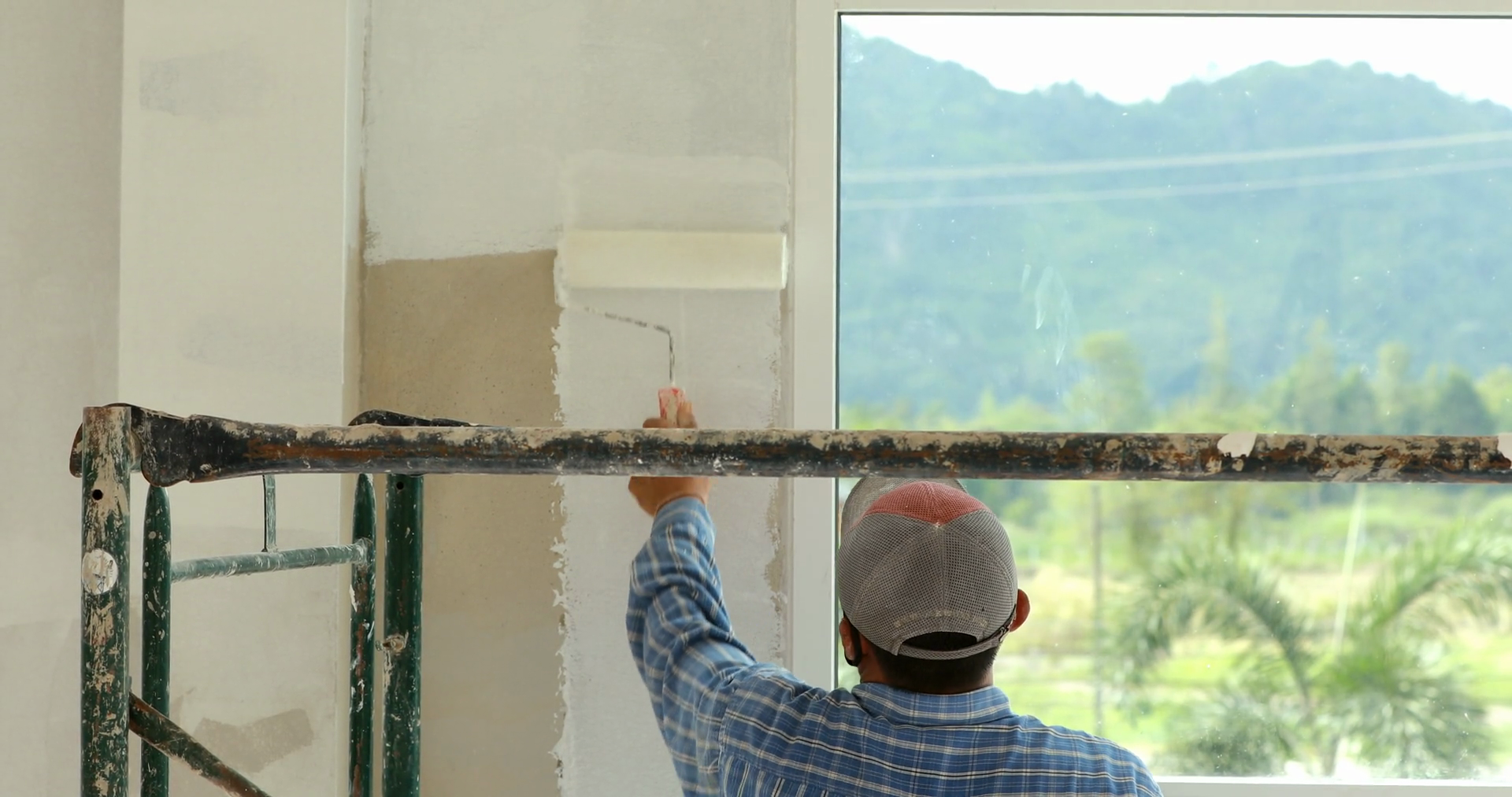 Painter painting a wall Stock Video Footage - Storyblocks