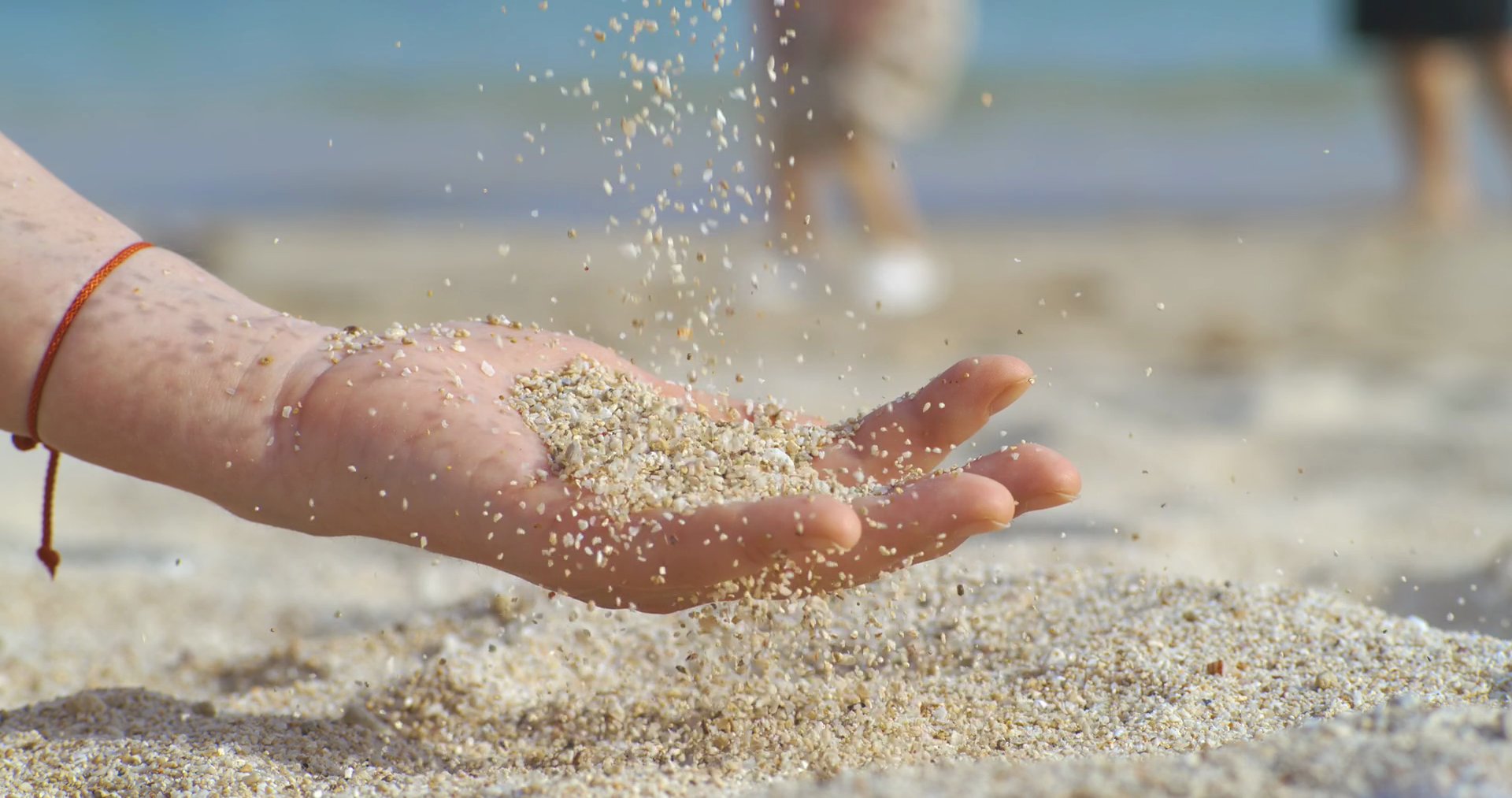 Sand Falling From Hand In Slow Motion On Stock Footage SBV-352260453 ...